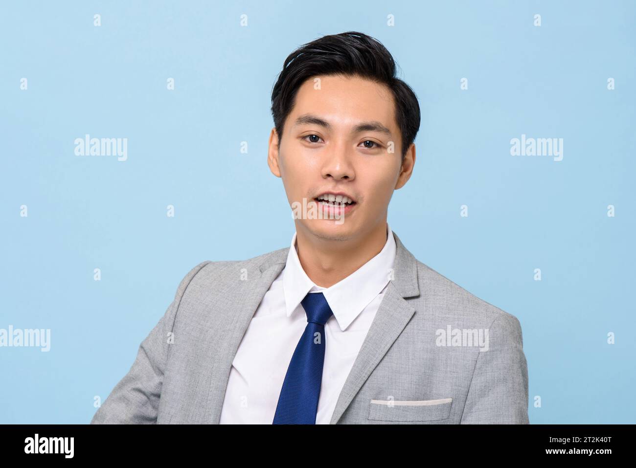 Portrait of young handsome Asian man in formal business suit on ...