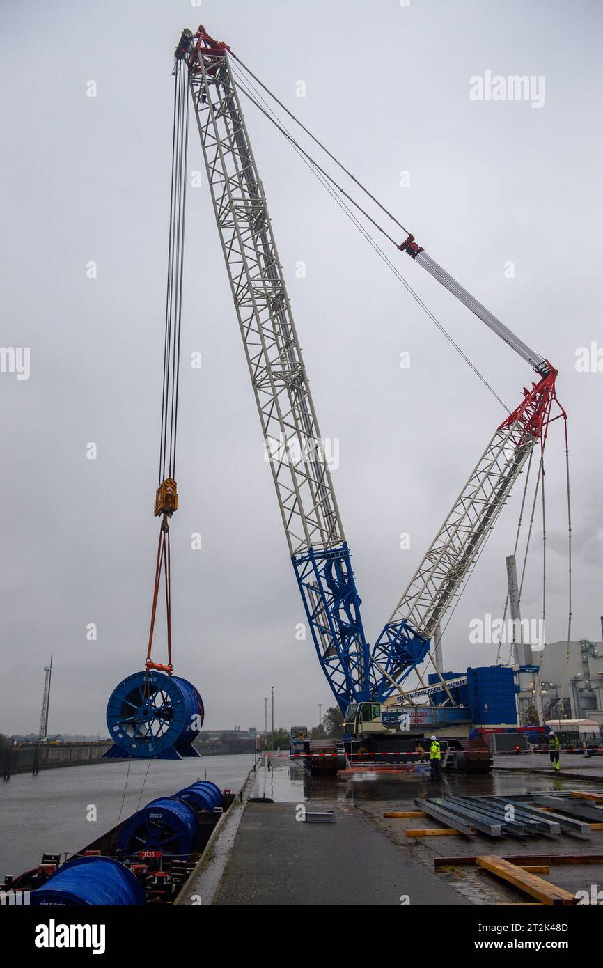 Magdeburg, Germany. 20th Oct, 2023. A crane lifts a cable drum from a ...