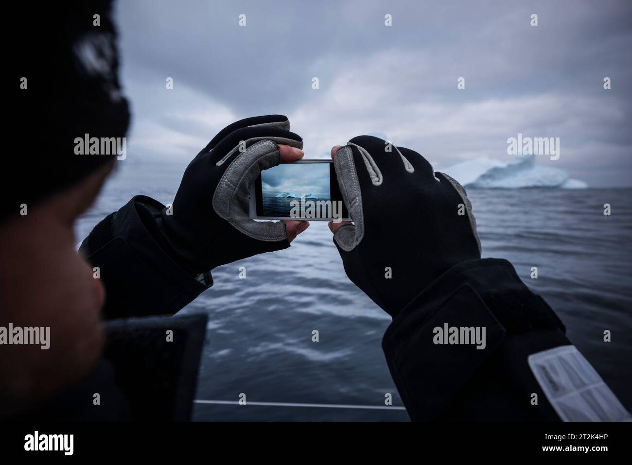 Using smartphone to photograph Iceberg in Denmark Straight near east ...
