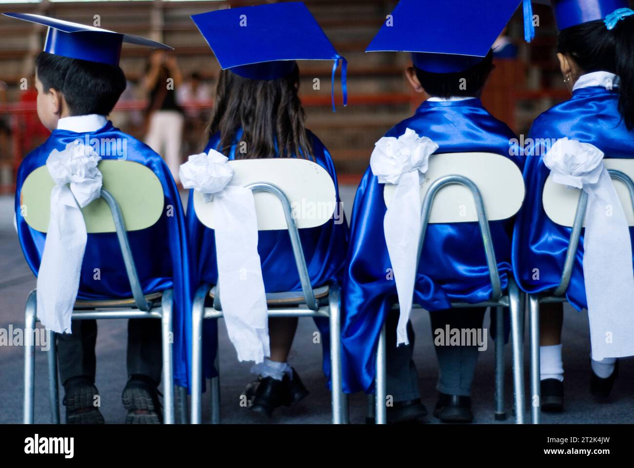A group of elementary age students sit during graduation services Stock ...