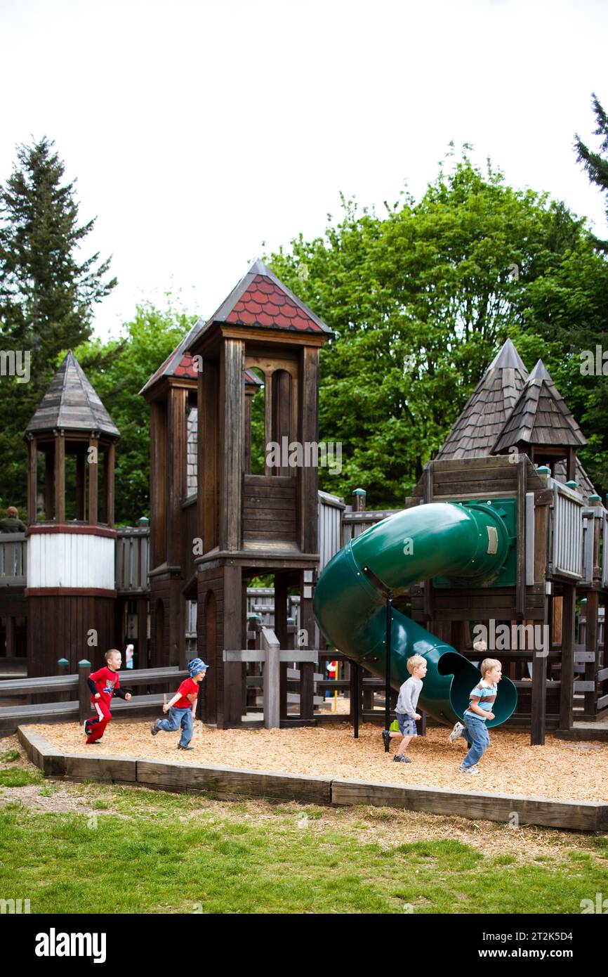 Kids play at a local park's playground Stock Photo - Alamy