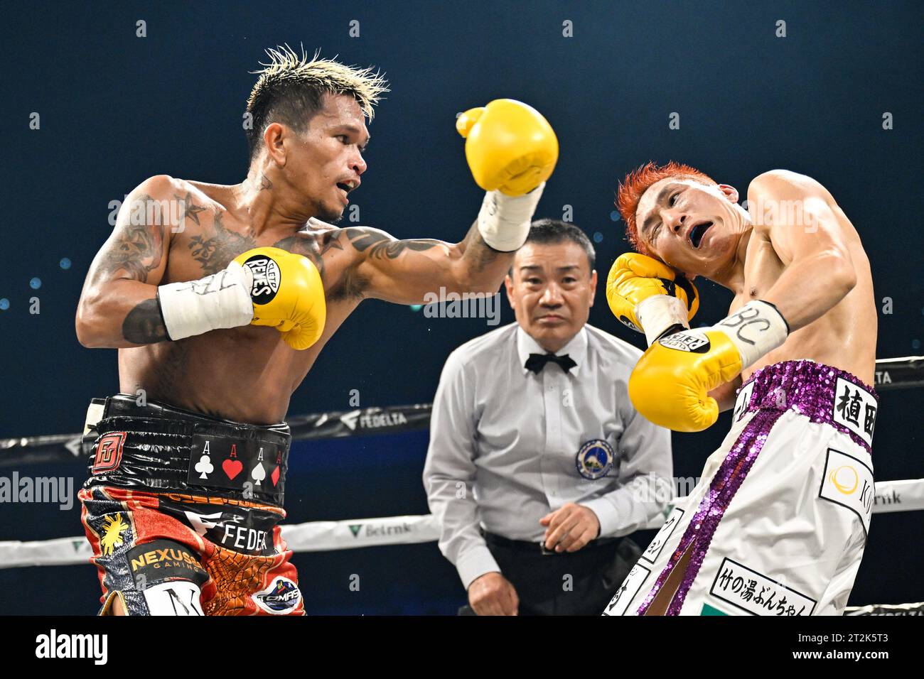 John Riel Casimero (red trunks) of the Philippines and Yukinori Oguni (white trunks) of Japan ...