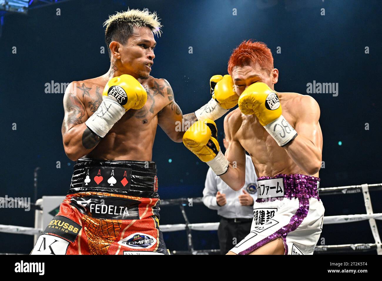 John Riel Casimero (red trunks) of the Philippines and Yukinori Oguni (white trunks) of Japan ...
