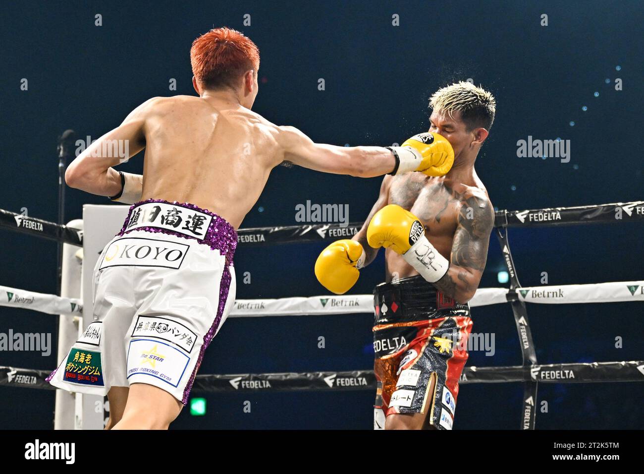 John Riel Casimero (red trunks) of the Philippines and Yukinori Oguni (white trunks) of Japan ...