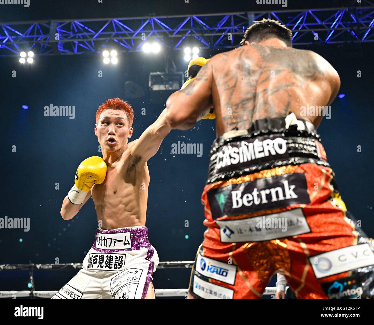 John Riel Casimero (red trunks) of the Philippines and Yukinori Oguni (white trunks) of Japan ...