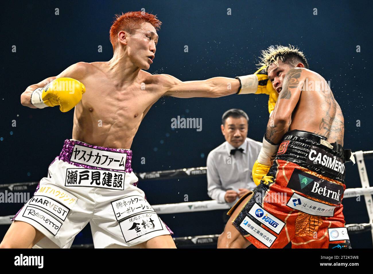 John Riel Casimero (red trunks) of the Philippines and Yukinori Oguni (white trunks) of Japan ...