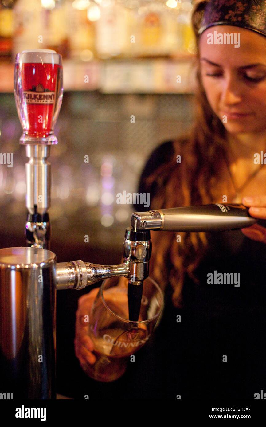Woman pours beer bar hi-res stock photography and images - Alamy