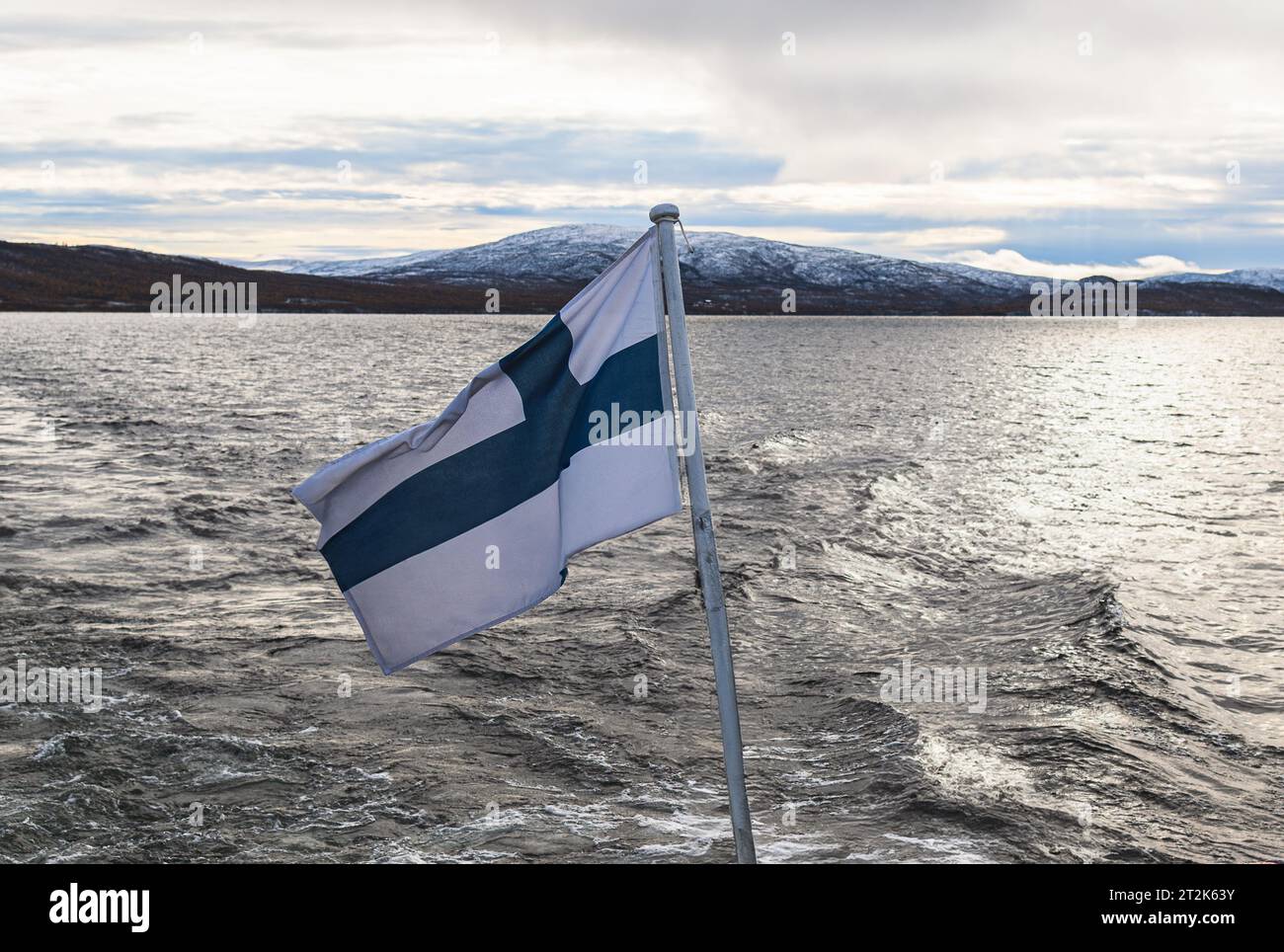 Finland flag waving on the wind in the lake Stock Photo - Alamy