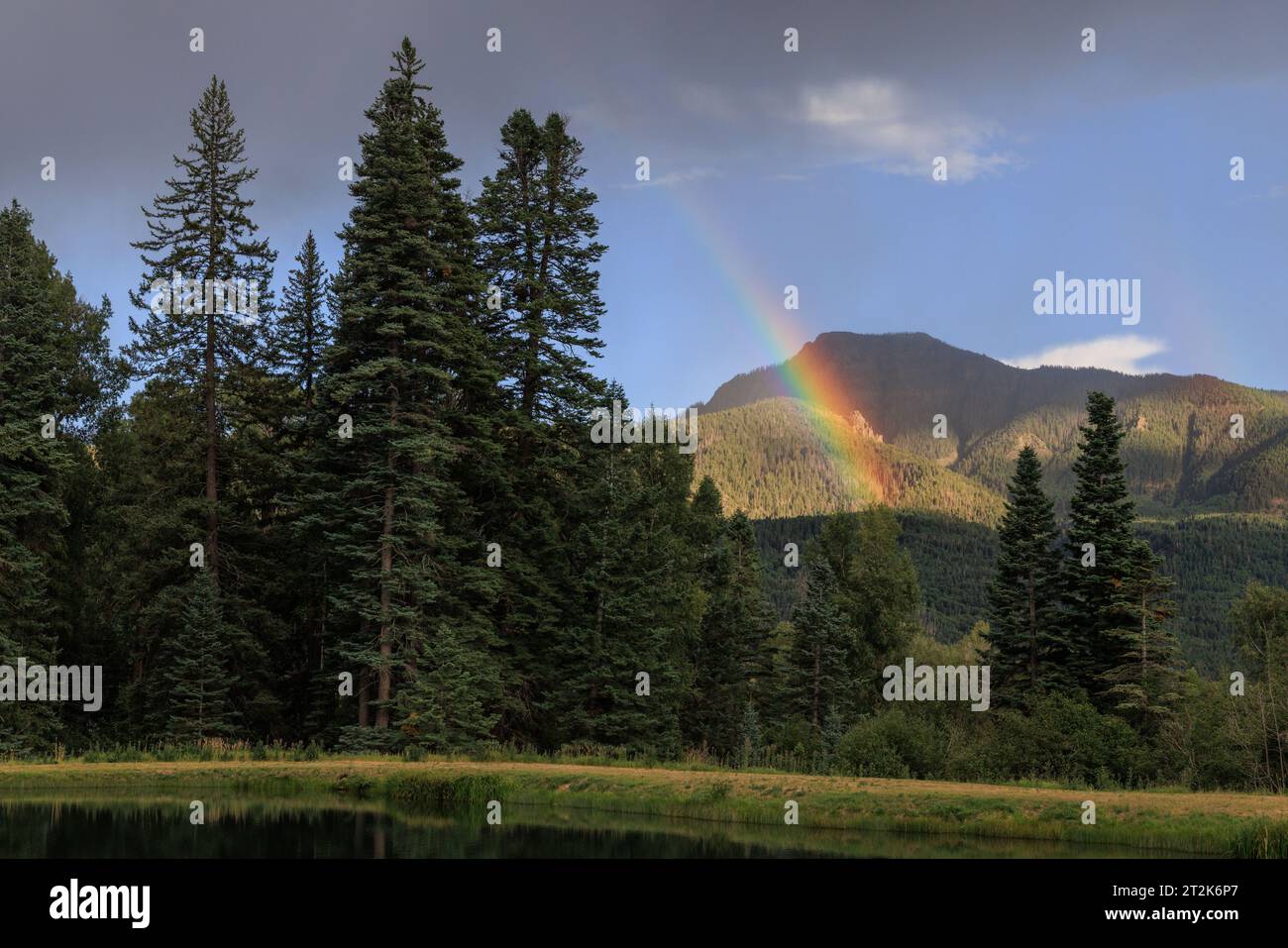 A rainbow seen in mountains in Colorado's San Juan National Forest ...
