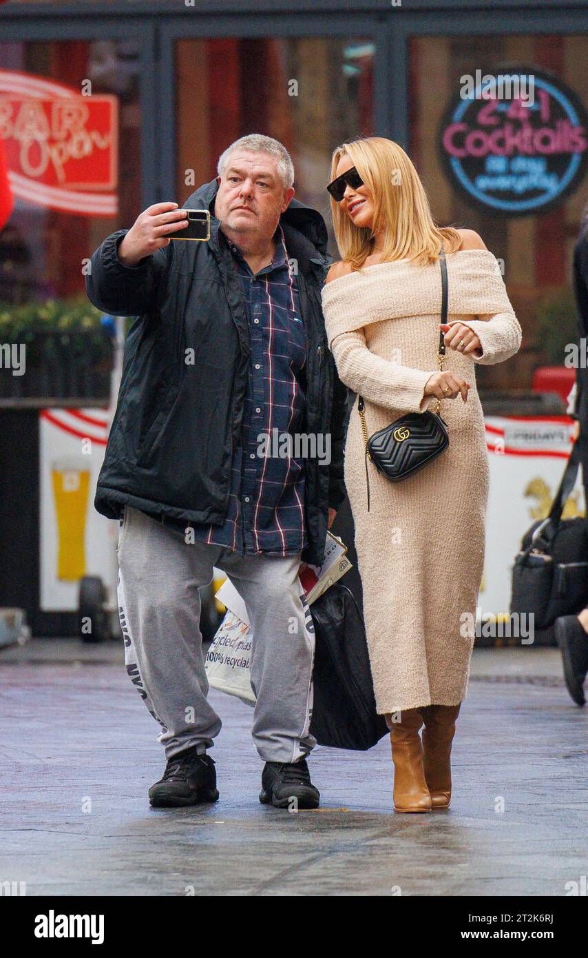 London, UK. 20th Oct, 2023. A fan takes a selfie with Amanda Holden ...