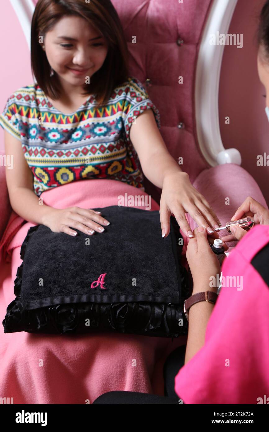 Asian nail technician hi-res stock photography and images - Alamy
