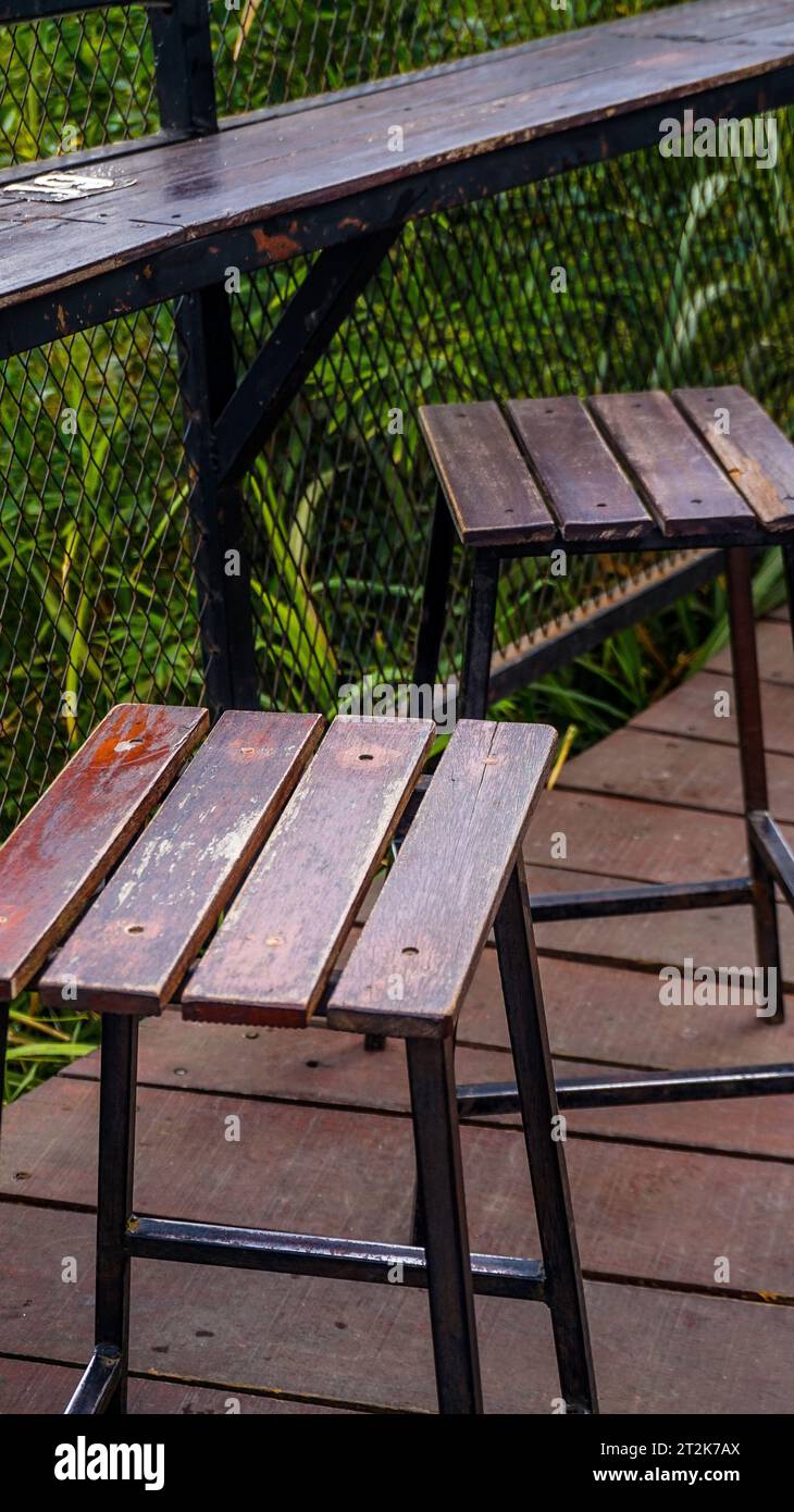 The chairs and relaxing tables in this brown garden are made of wood ...