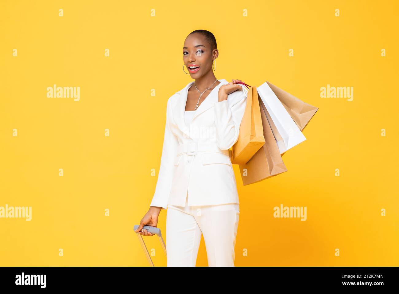 Happy african american shopaholic young woman with shaved head holding ...