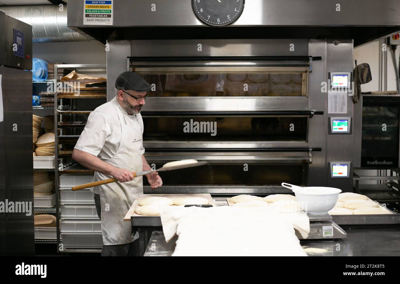 Lead baker Nick Metcalfe preparing Stotties's at the Big River bakery ...