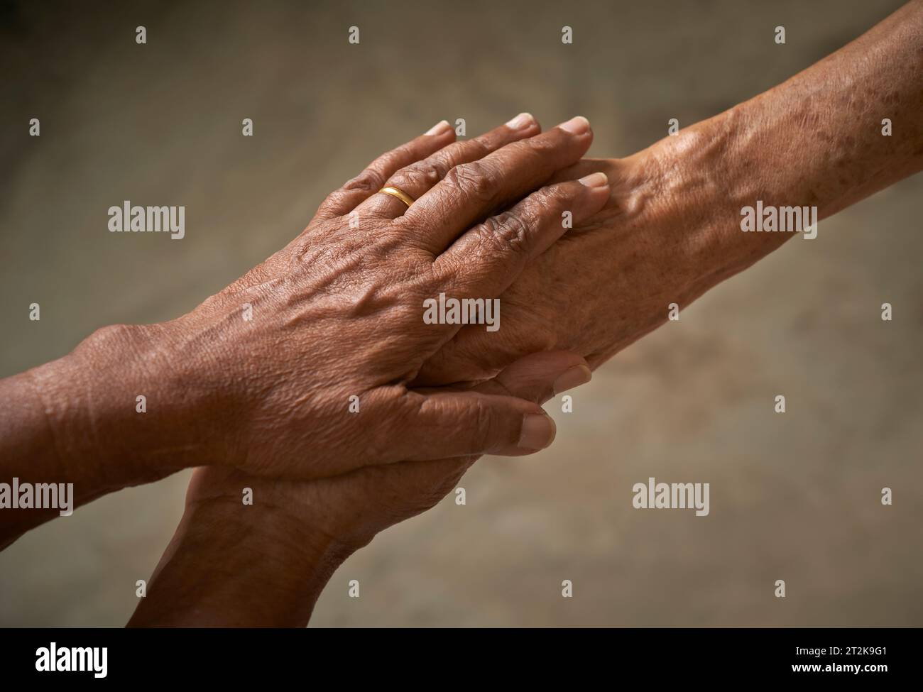 Caregiver, carer hand holding elderly hand. People helping and ...