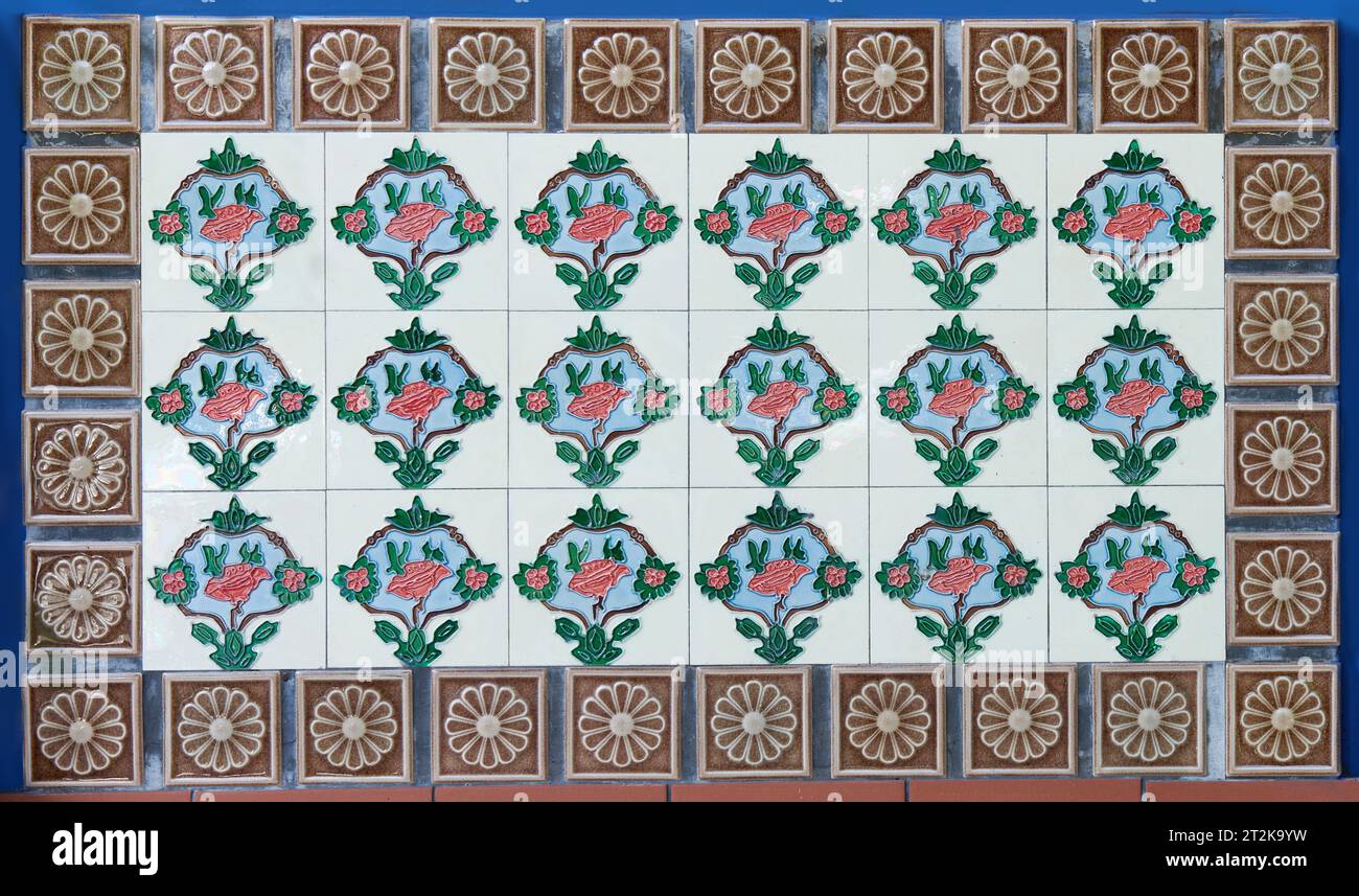 Rows of antique Nyonya Tiles with colourful flowers. Vintage wall tile ...