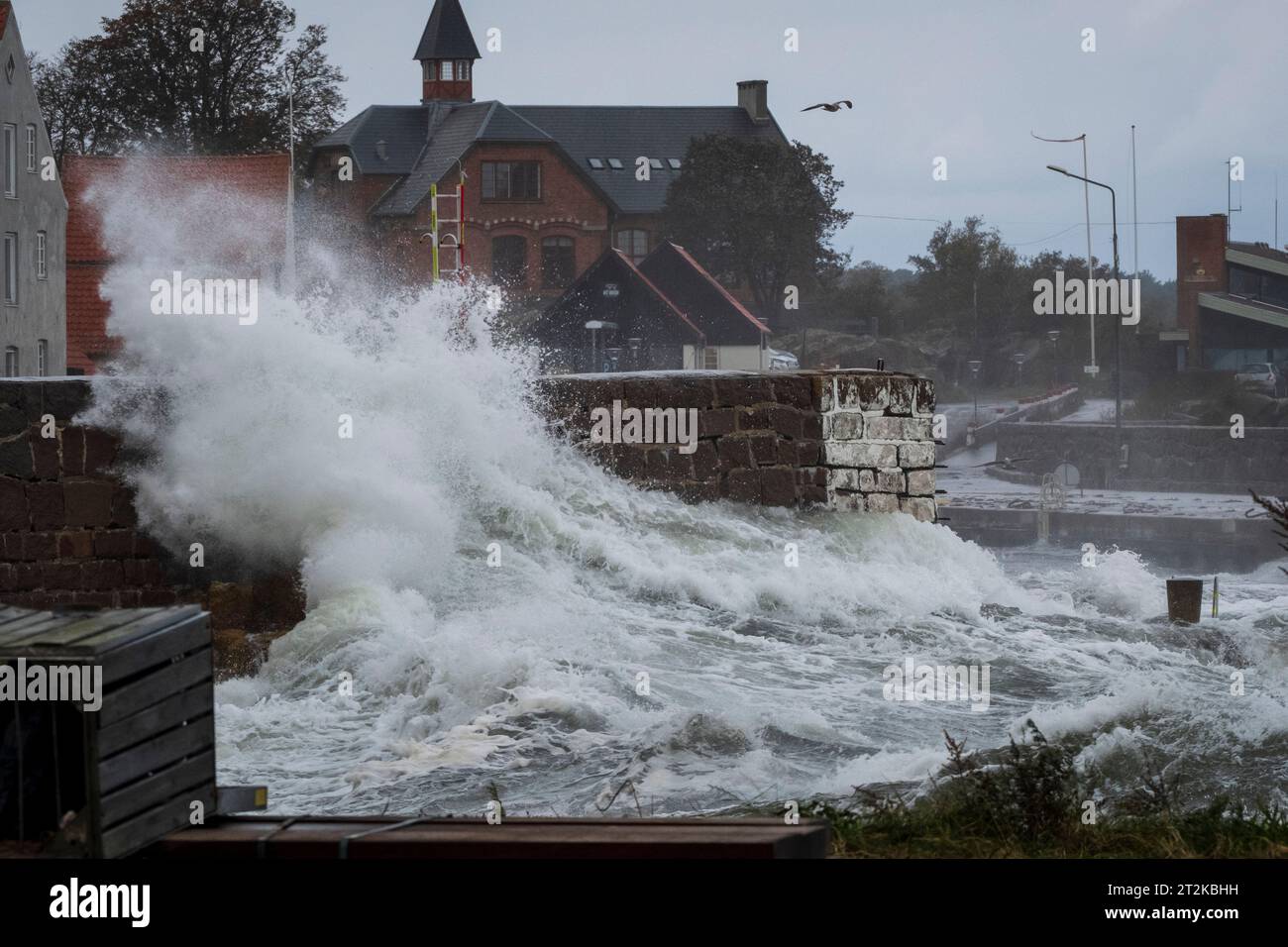 Denmark, October 20, 2023. Waves crash against a pier on Bornholm's ...