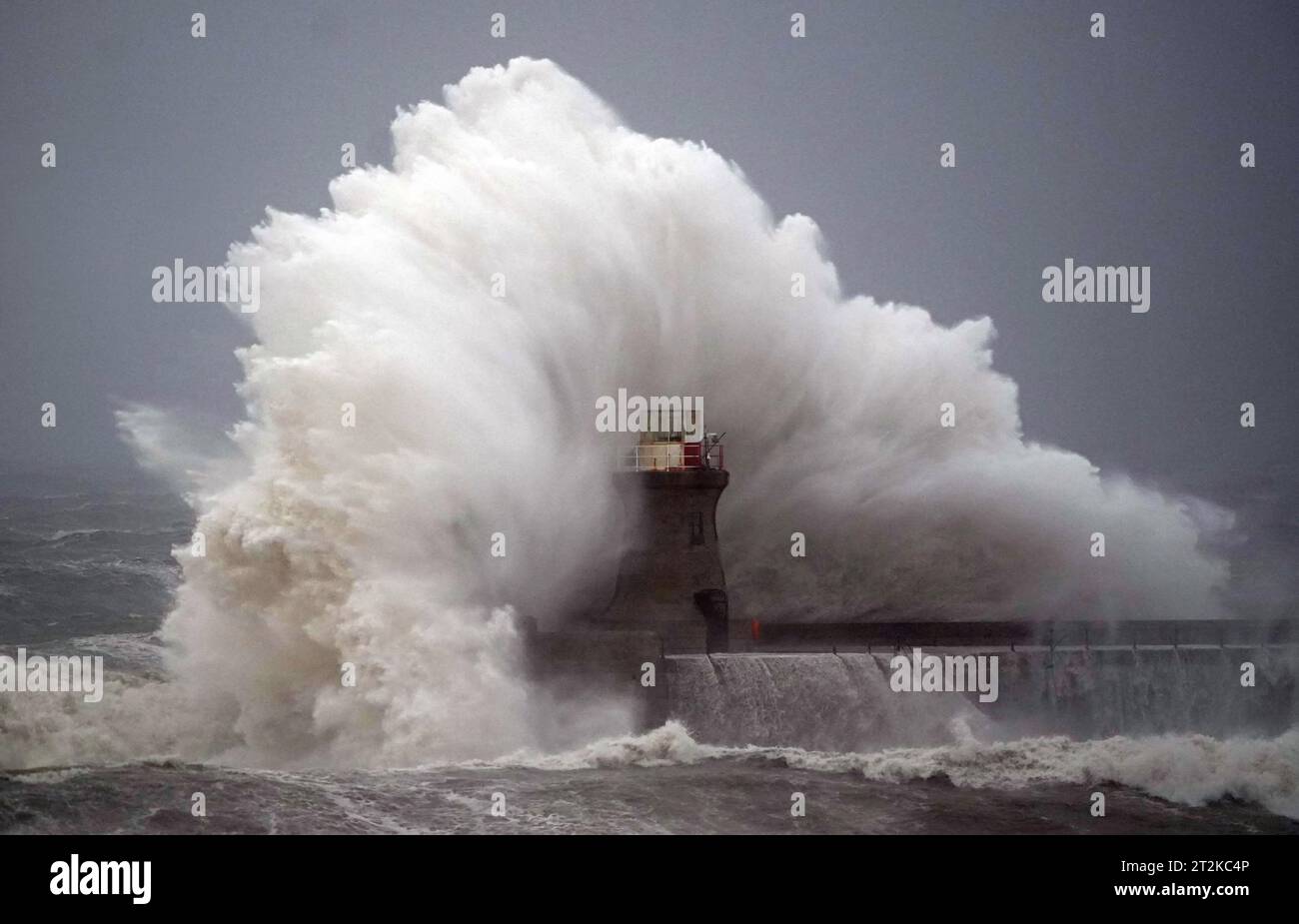 Waves crash against South Shields lighthouse after the top was ripped ...