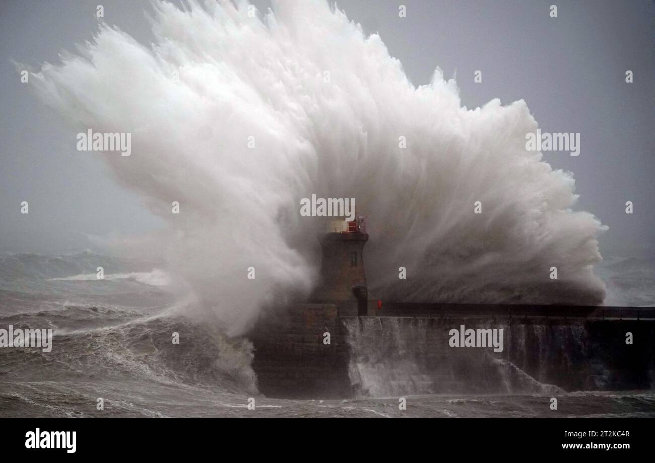 Waves crash against South Shields lighthouse after the top was ripped ...