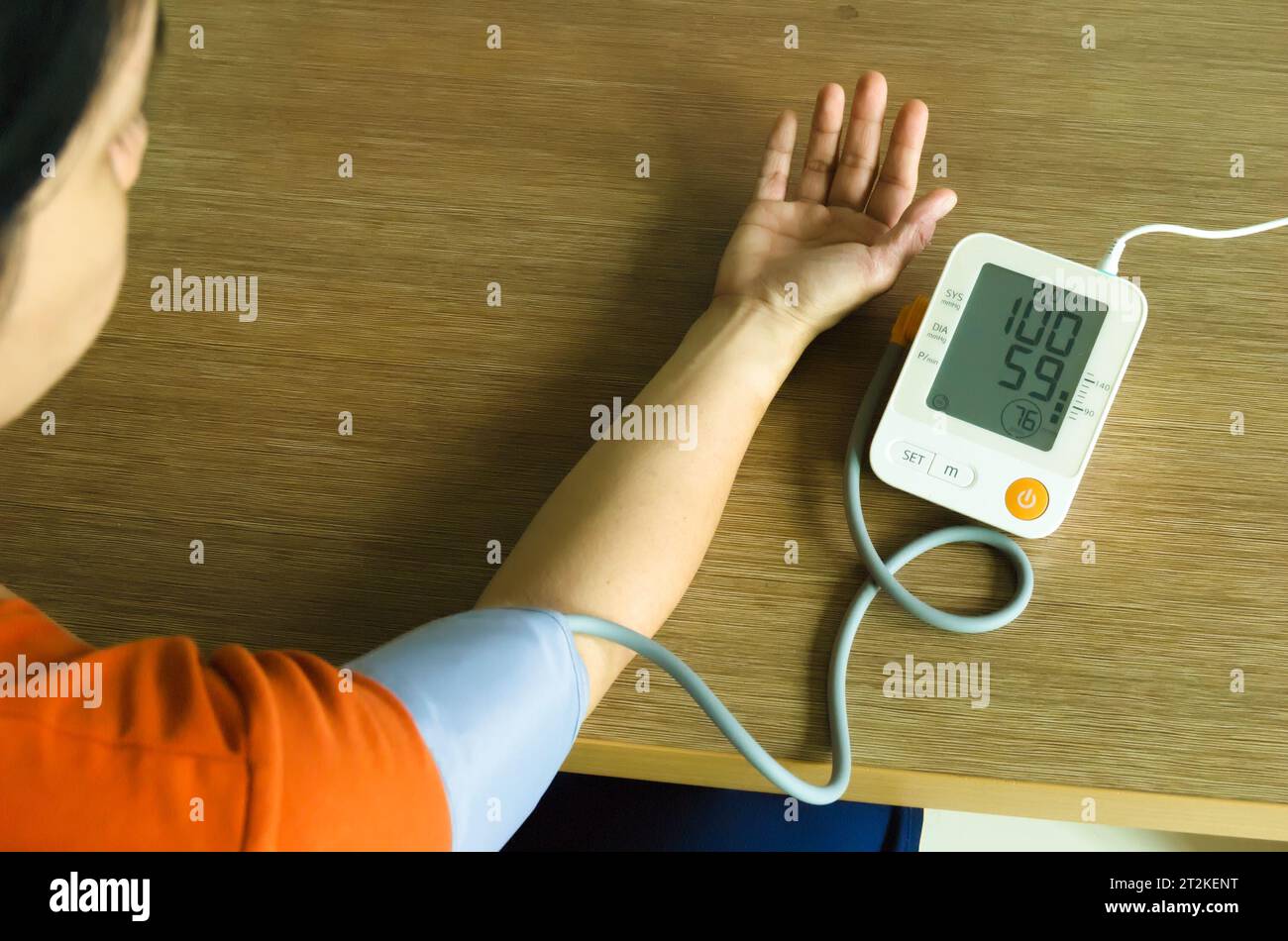 Asian Woman checking blood pressure and heart rate with standard blood ...
