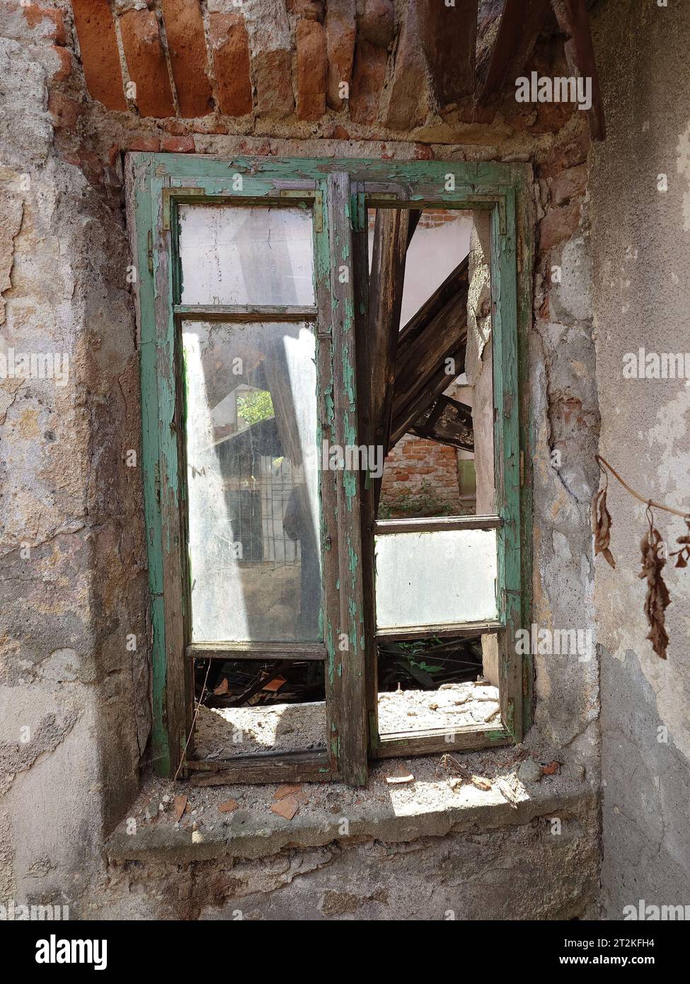 Dilapidated building facade. Cracked and pealed exterior plaster on ...
