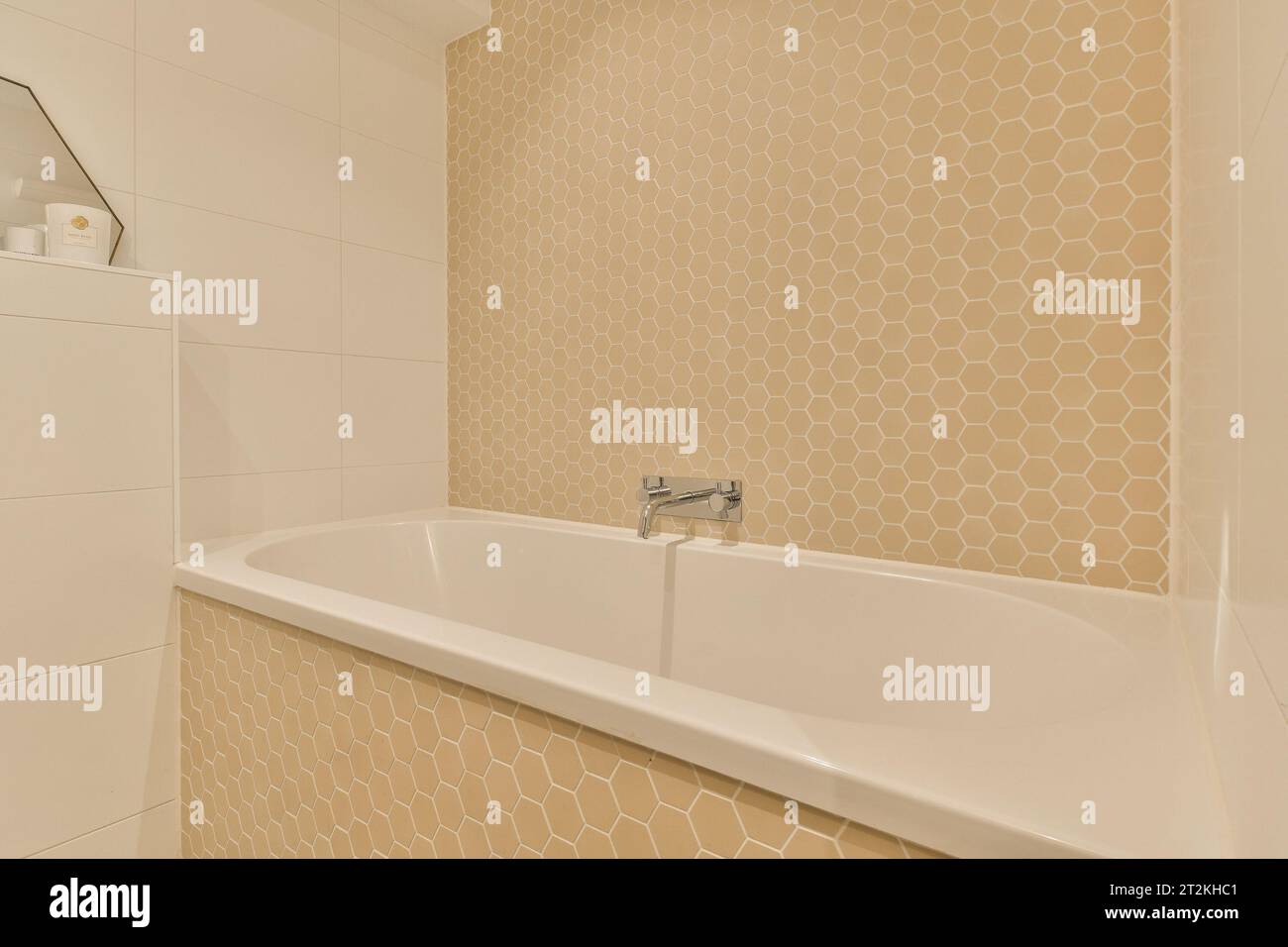 a bathroom with hexagon tiles on the wall and bathtub in the corner ...