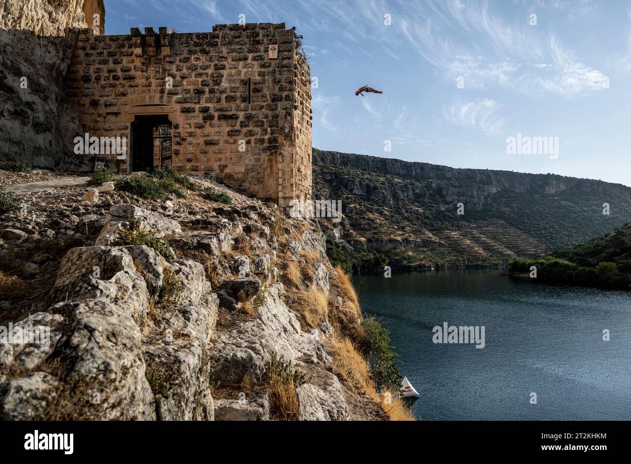 Perched on the serene banks of the Euphrates River in the southern ...
