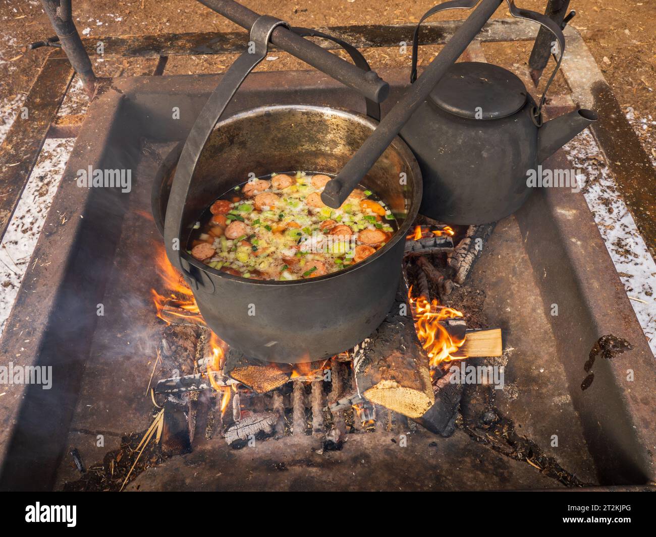 Cooking outdoors in iron cauldron hi-res stock photography and images ...