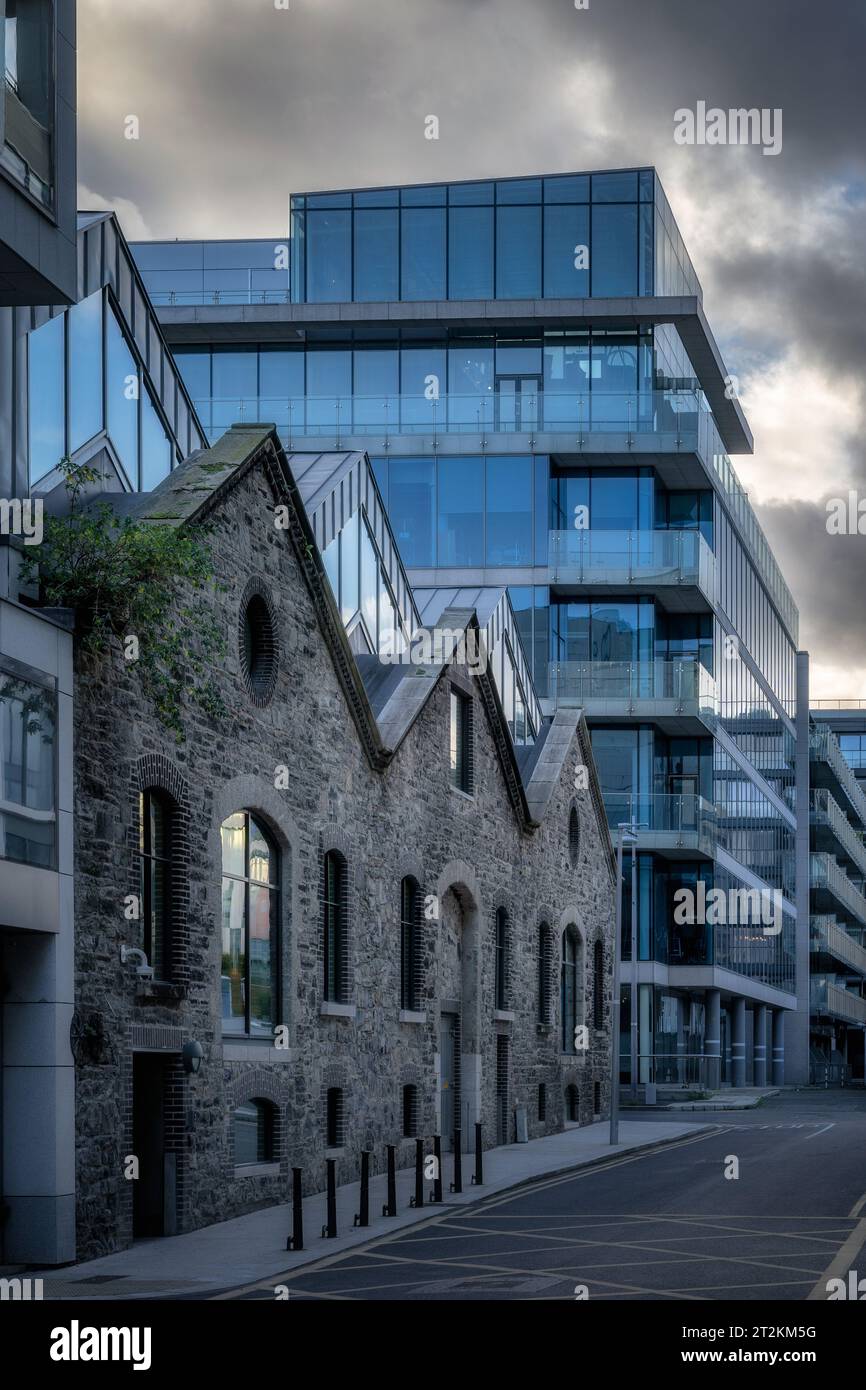 Old building converted to modern one with preserved retro facade. Mix ...