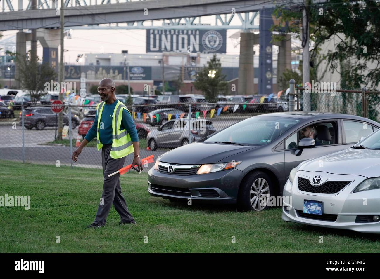 Reginald Rawls directs a car into a spot at the Calvary Baptist Church ...