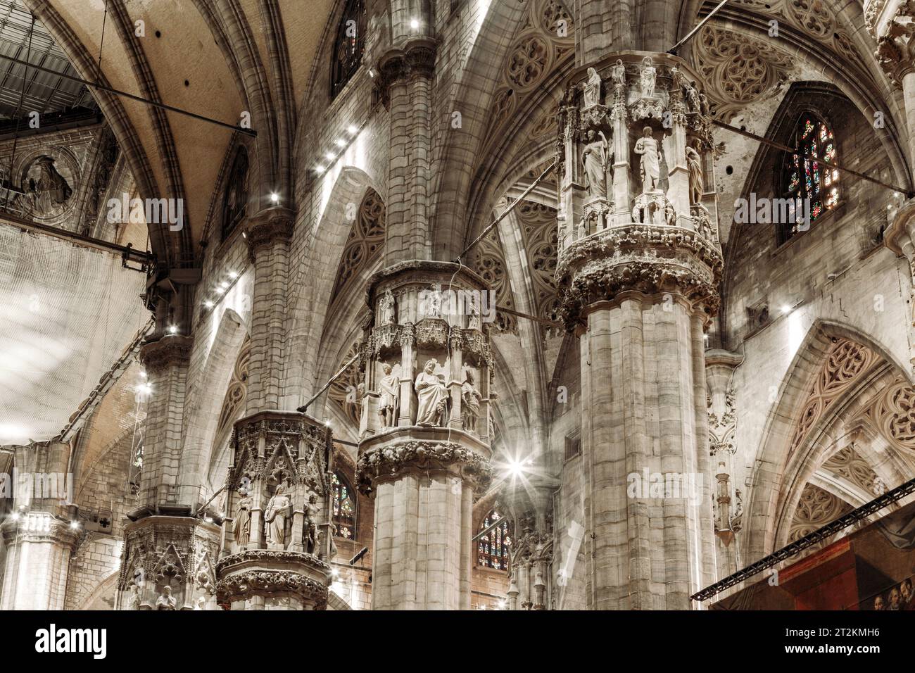 Inside the famous Duomo, the cathedral of Milan city, Italy, also known ...