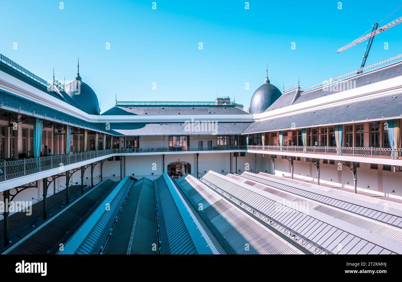 An aerial view of a contemporary building with three distinct walkways ...
