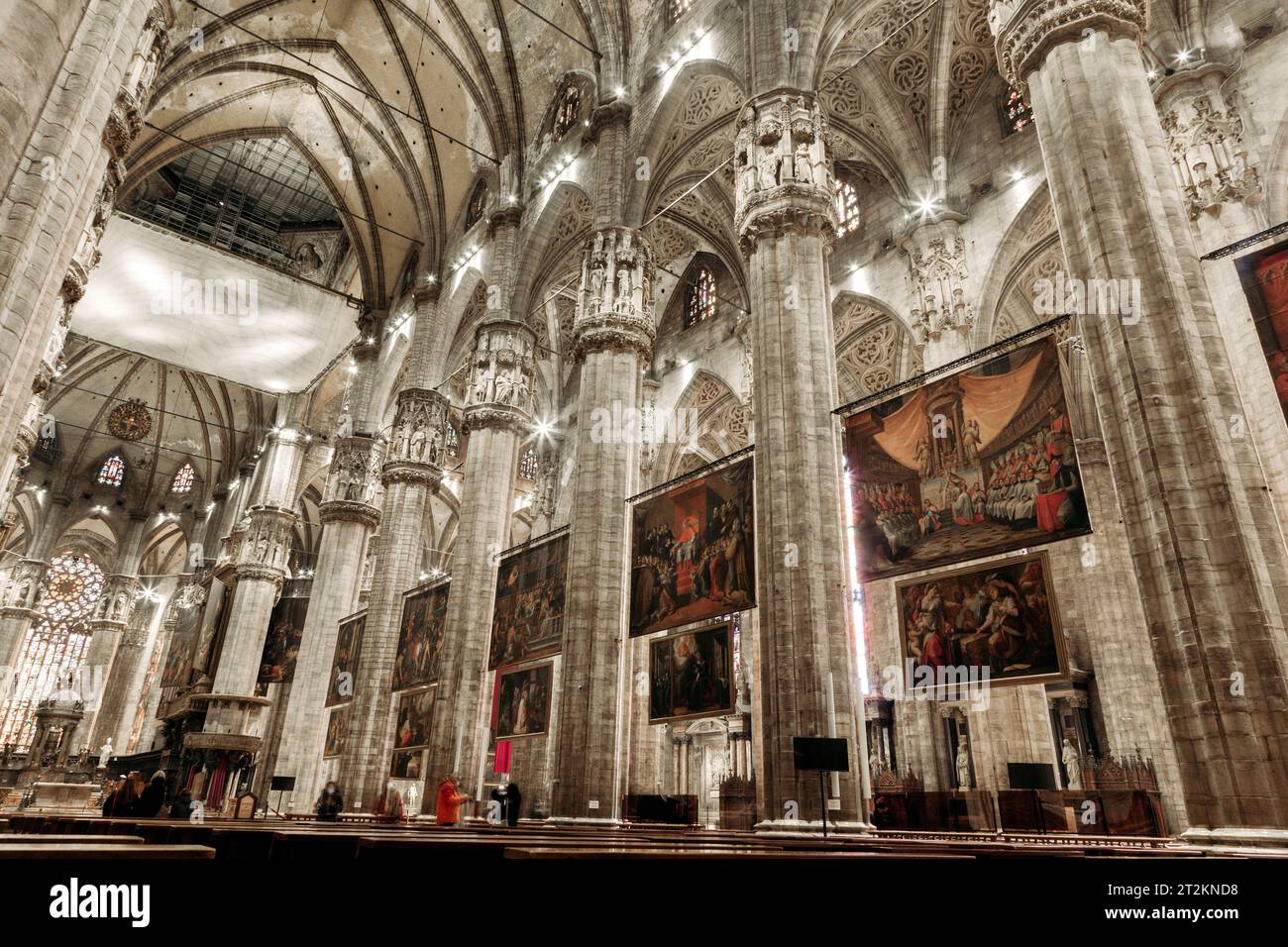 Inside the famous Duomo, the cathedral of Milan city, Italy, also known ...