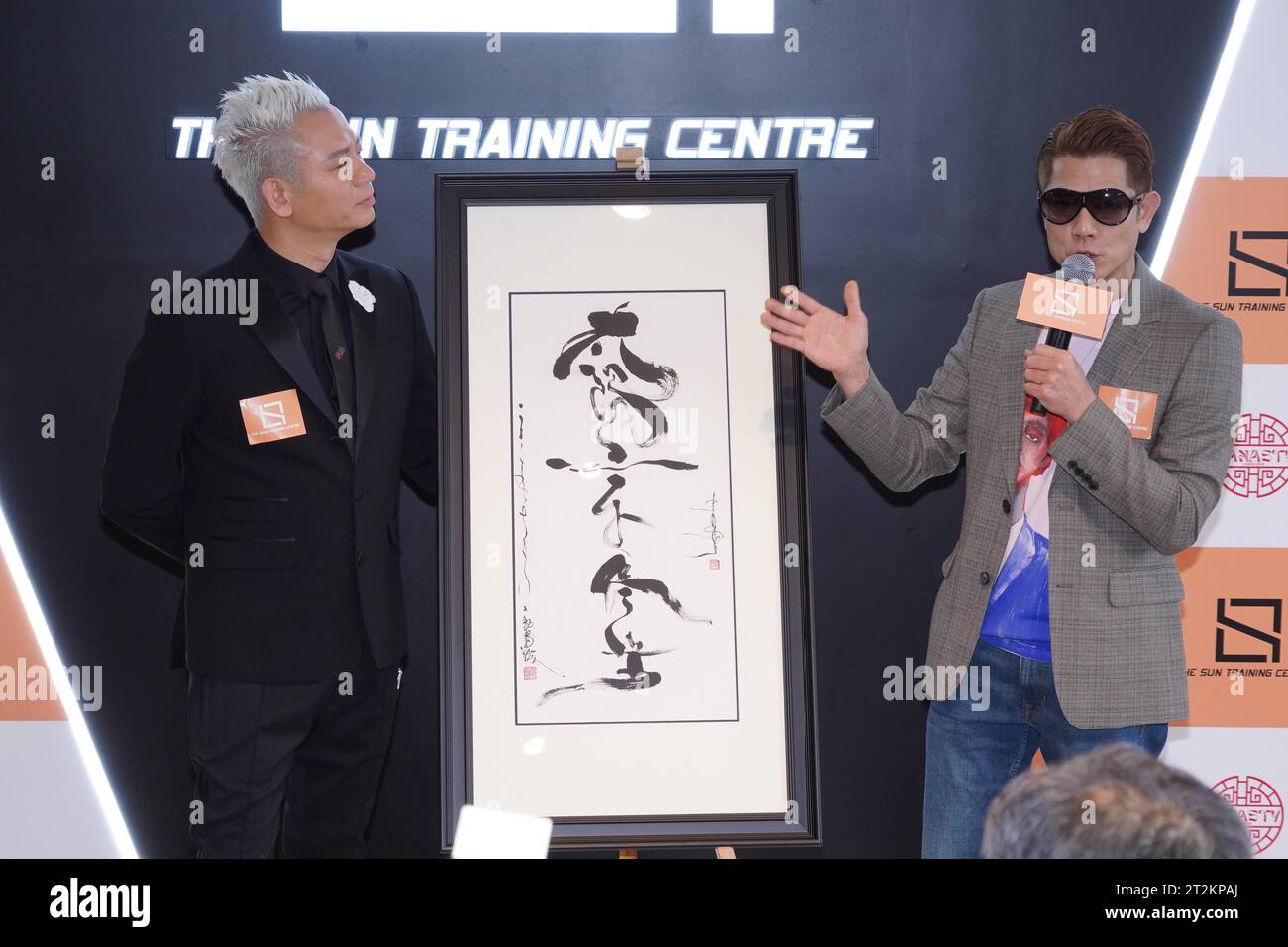 Hong Kong singer, dancer and actor Aaron Kwok (right) attends an activity in Hong Kong, China ...