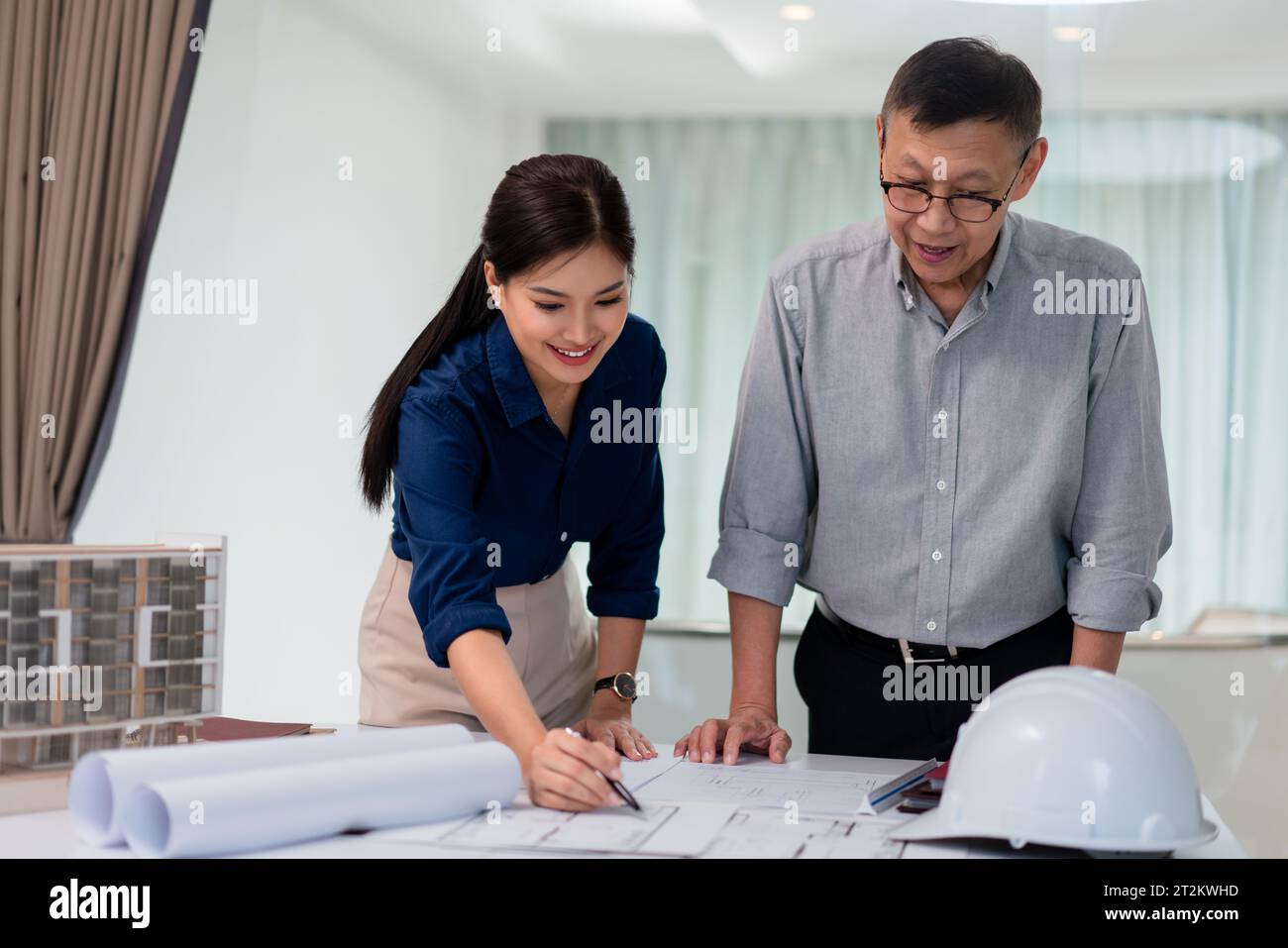 Two architects are discussion and analysis about construction of ...