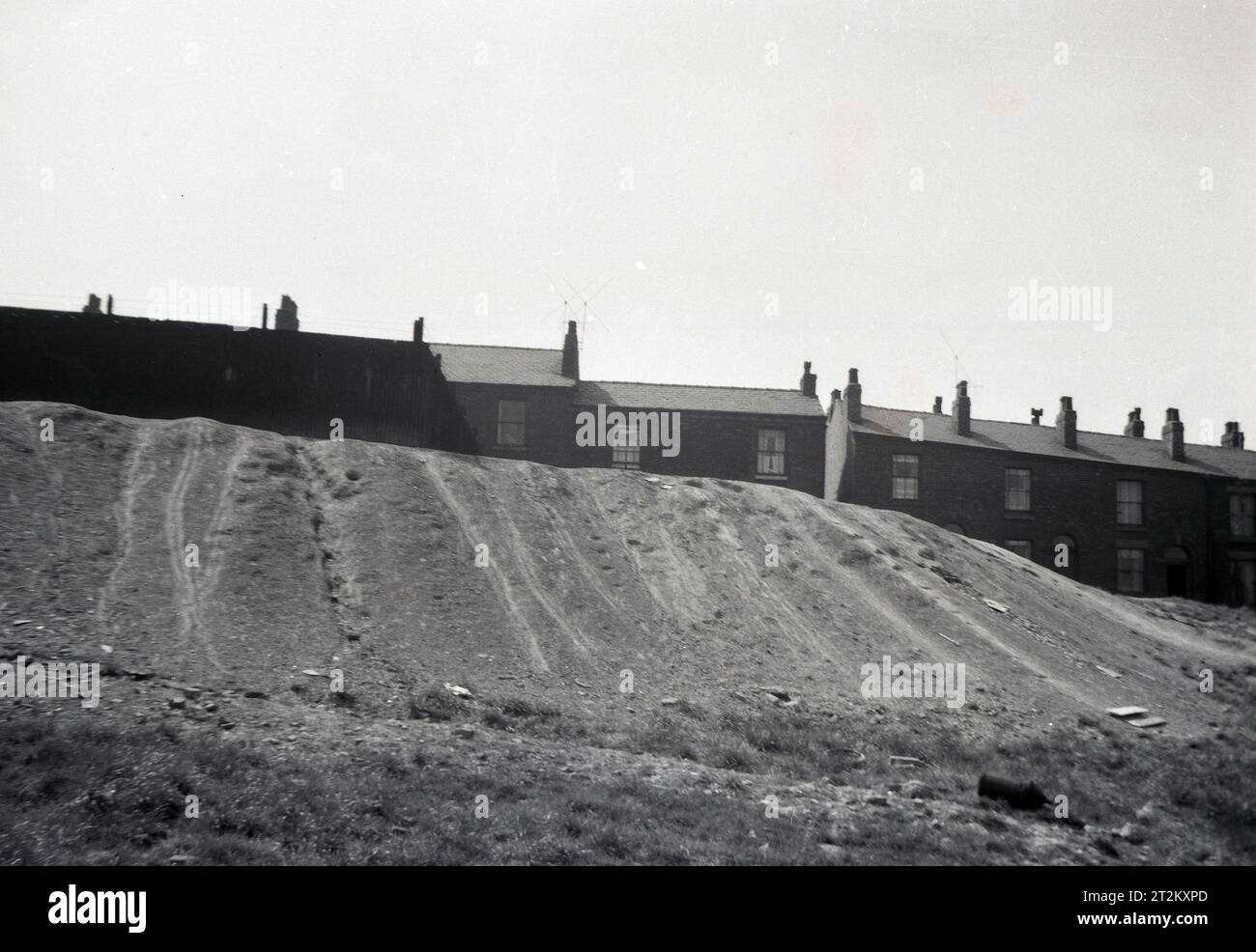 1960s, historical, large earth oud behind victorian terrace houses ...