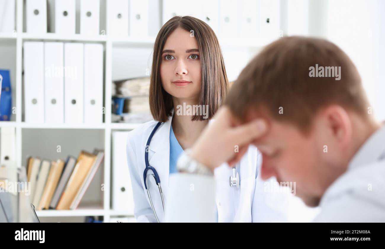 Friendly female doctor hold patient shoulder Stock Photo - Alamy