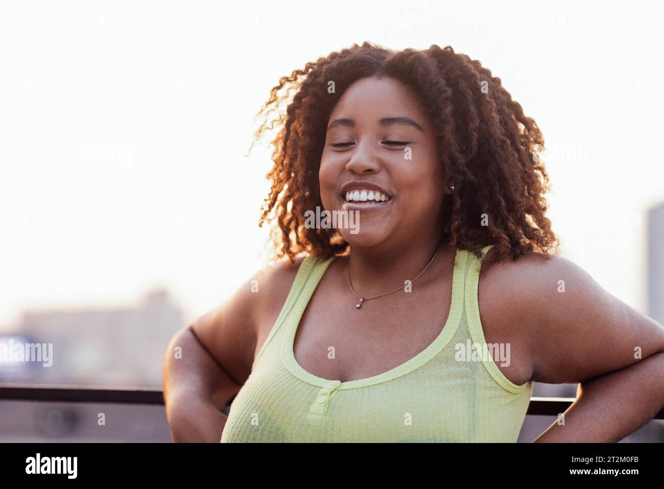Close-up of portrait of young curvy attractive African. Charming dark ...