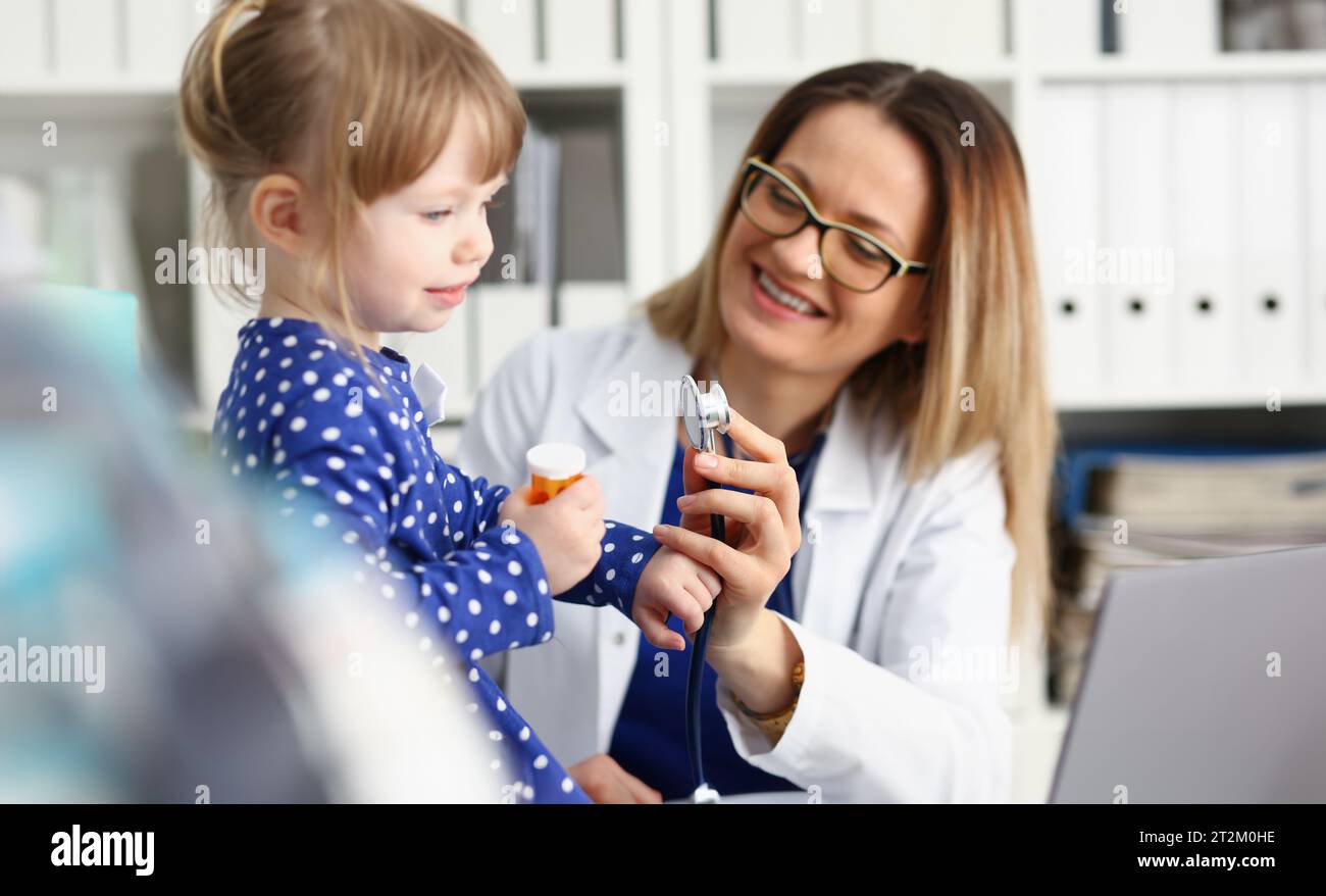 Little child with stethoscope at doctor reception Stock Photo - Alamy