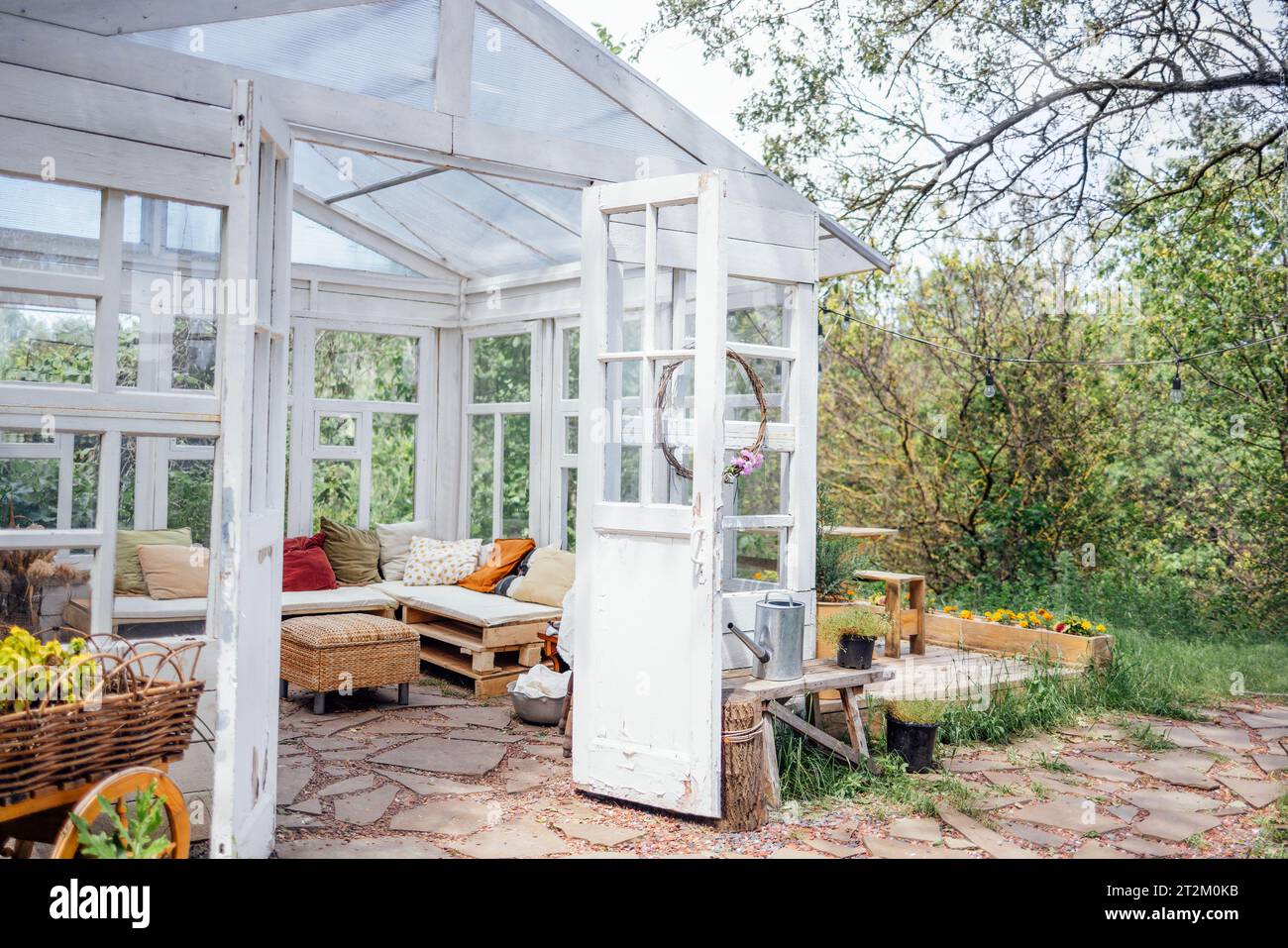 A cozy place on the veranda of the house with a vintage table with ...