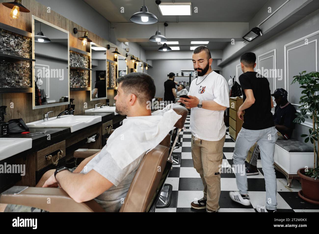 ISTANBUL, TURKEY - MAY 16, 2022: Hairstylist doing beard haircut for ...