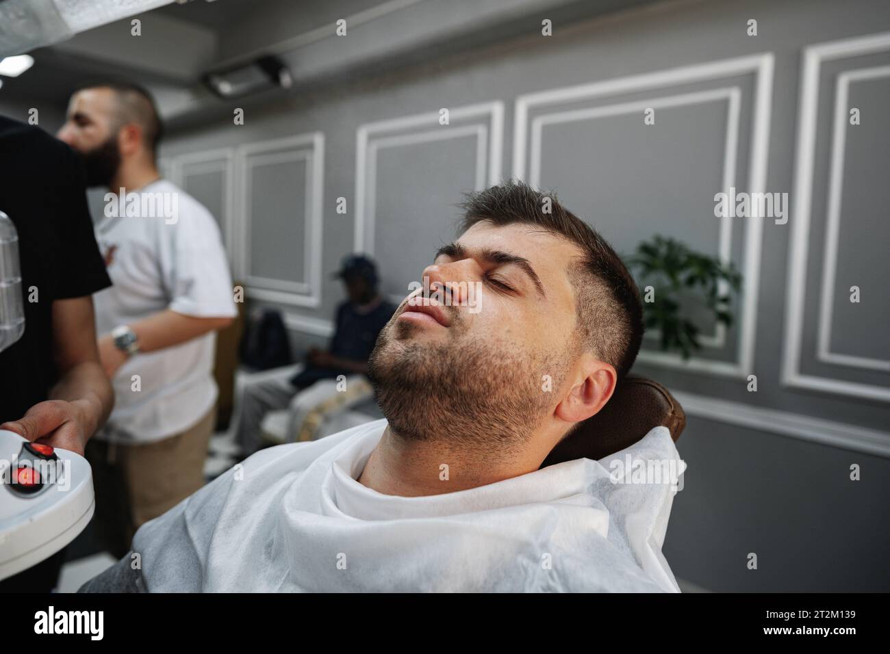 ISTANBUL, TURKEY - MAY 16, 2022: Hairstylist doing beard haircut for ...