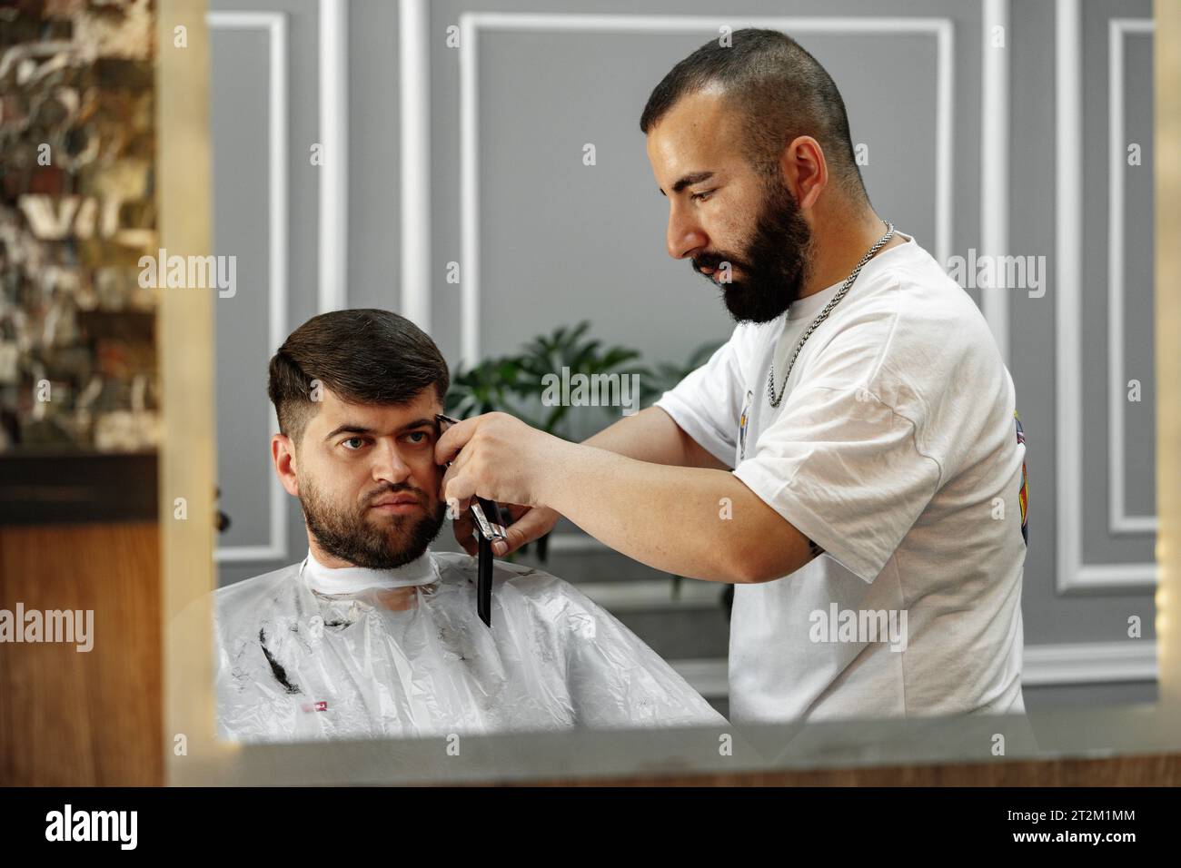 ISTANBUL, TURKEY - MAY 16, 2022: Hairstylist doing haircut for client ...