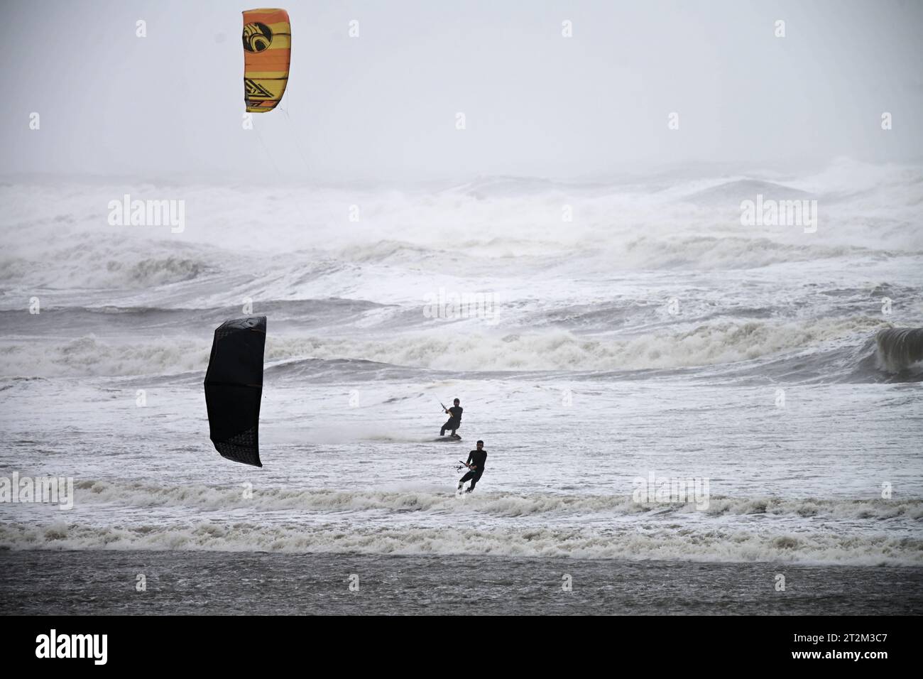 Two wind surfers in the North sea off Tynemouth during storm Babet ...