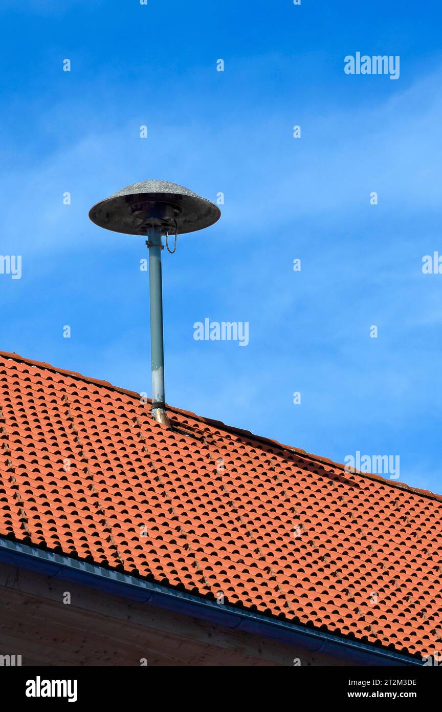 Old siren on red tiled roof in Allgaeu, Bavaria, Germany Stock Photo ...
