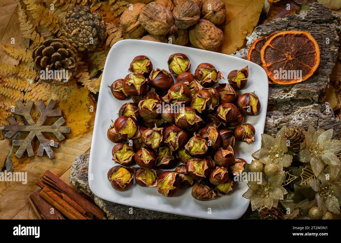 Roasted chestnuts surrounded by wintery decor Stock Photo - Alamy