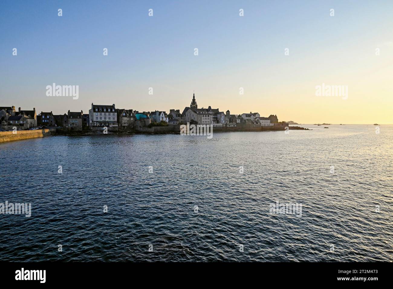 Old town with buildings and church tower by the sea, Roscoff, Finistere ...