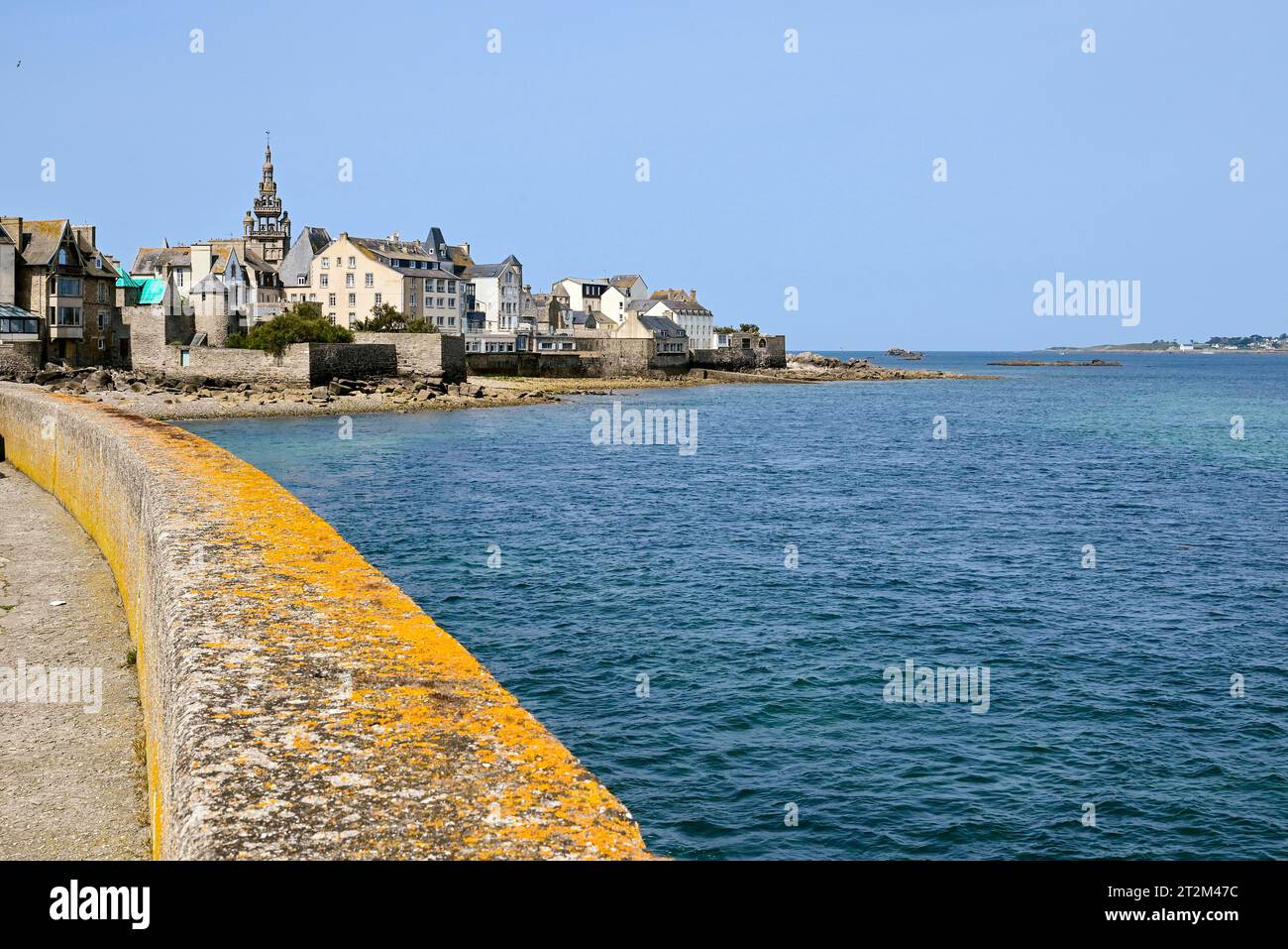Old town with buildings and church tower by the sea, Roscoff, Finistere ...