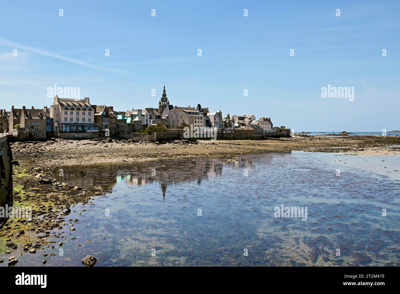 Old town with buildings and church tower by the sea, Roscoff, Finistere ...