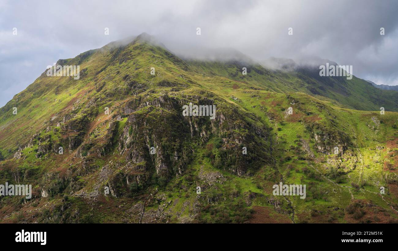 Typical landscape with mountains behind clouds in late summer ...